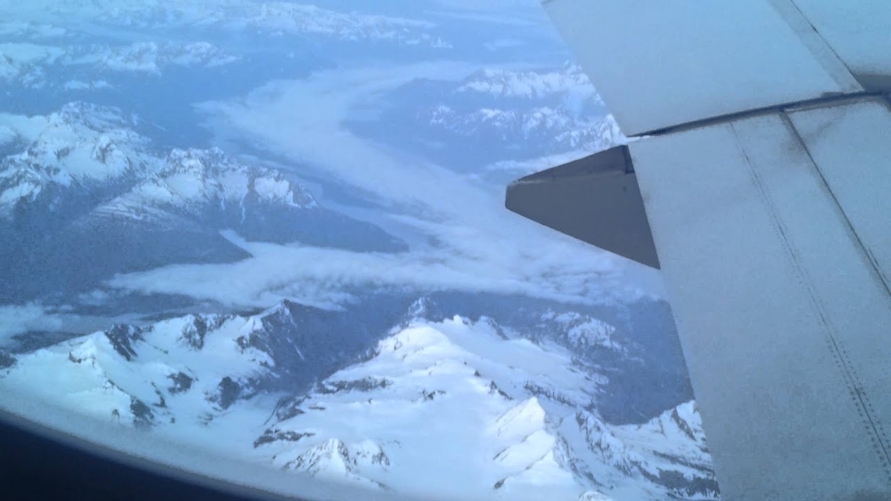 Looking down to a big mountain snow on Air China flight 996 - YouTube