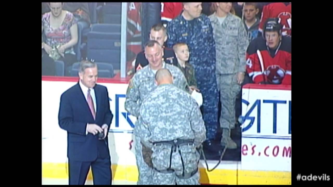 Army Captain Ryan Johnson sticks the landing at an Albany Devils game ...