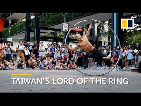 Taiwan’s ‘lord of the ring’ shows off giant metal hoop acrobatics