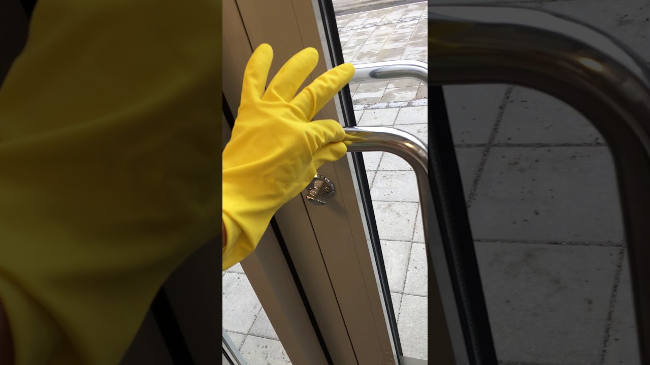 Carefully opening outside door with plastic gloves, because of Corona ...
