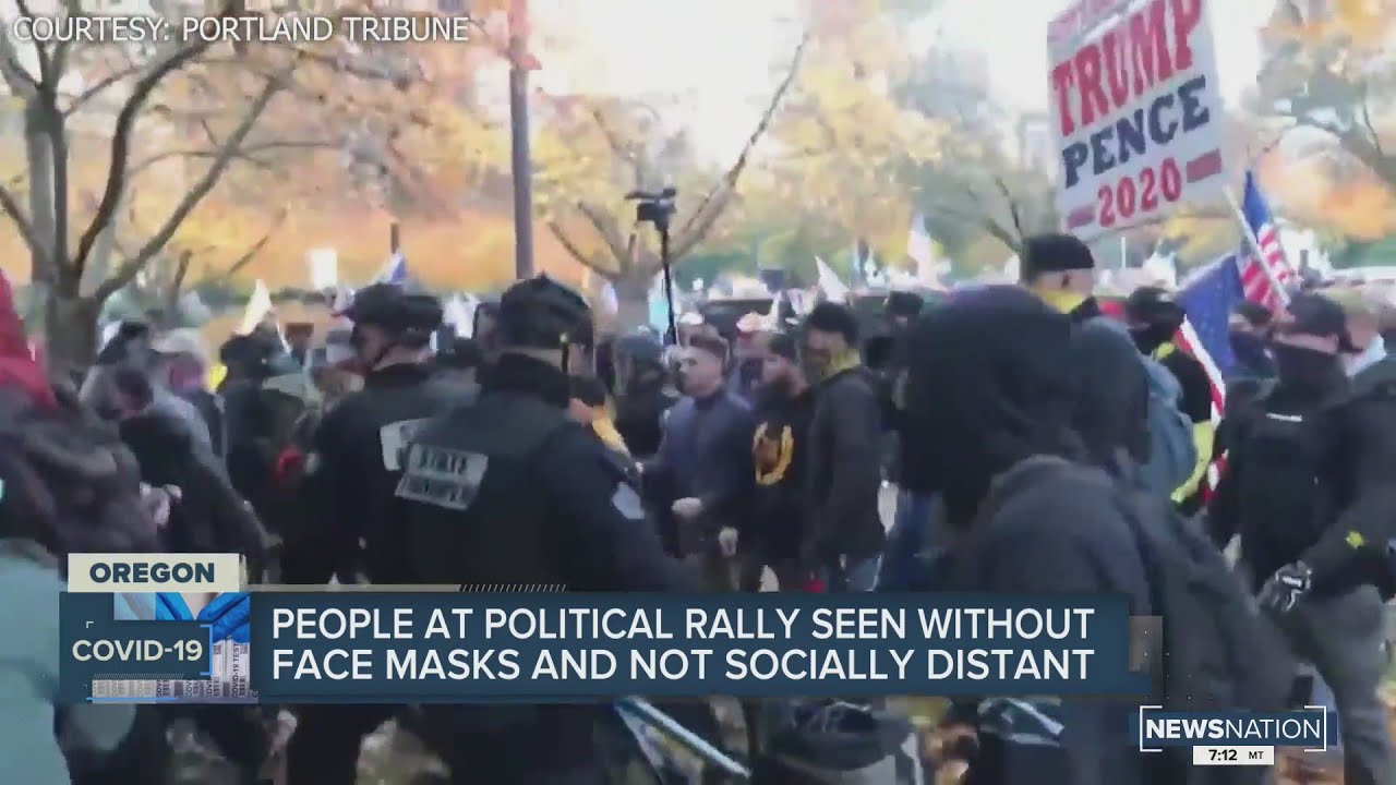People at political rally seen without face masks and not social ...