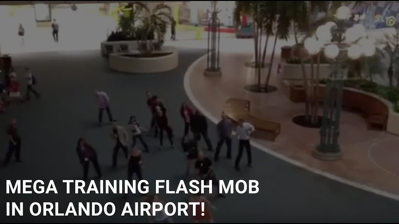 NPE Members MEGA TRAINING Flash Mob In Orlando Airport! - YouTube