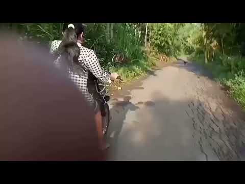 beautiful neighbor girl riding a smoky curved beam motorcycle