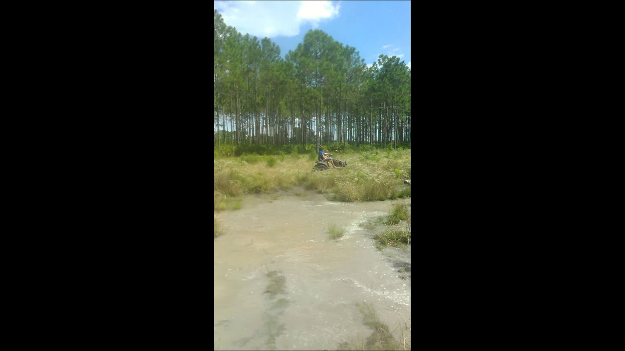 Mud bogging lawn mowers - YouTube
