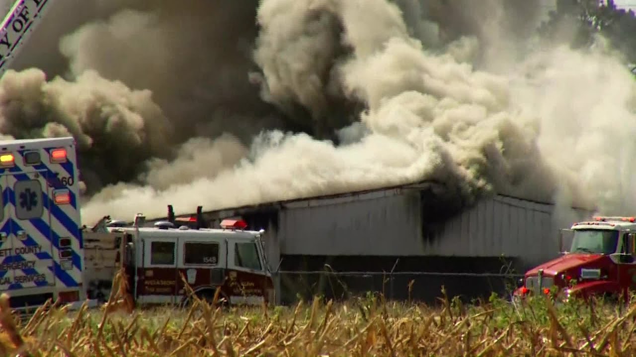 Crews work to put out 'large structure fire' in Dunn - YouTube