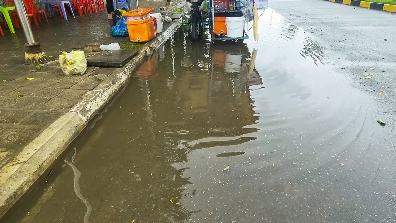 Remove Trash And Plastic Clogged Culvert Drain Water On Street Road ...