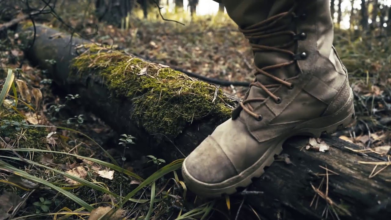 mens shoes in autumn a man tied a lacing on boots in the woods - YouTube