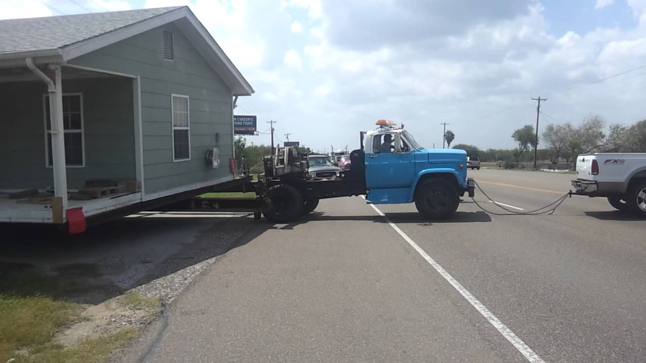 F250 pulling chevy and house - YouTube