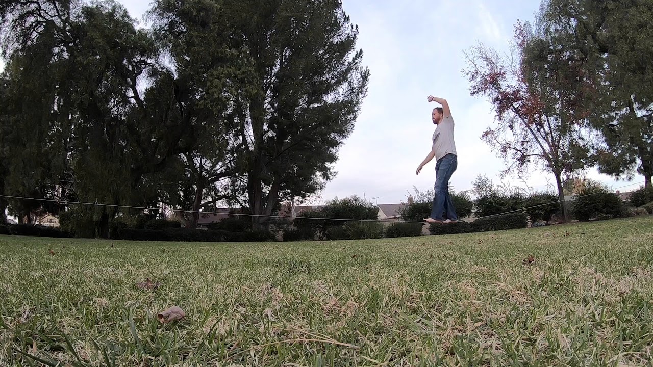 Attempting some basic tricks on a 100ft Slackline - YouTube
