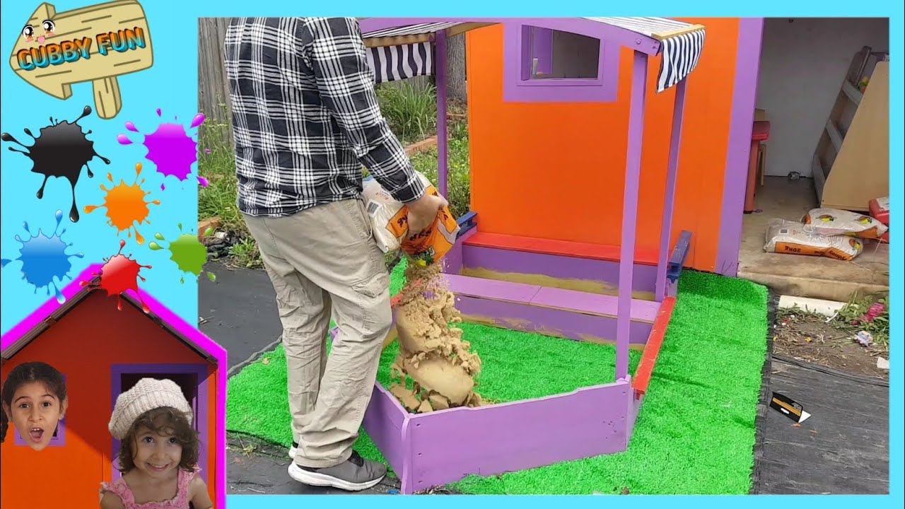 Filling a pirate ship sandbox sand pit with sand in the backyard play ...