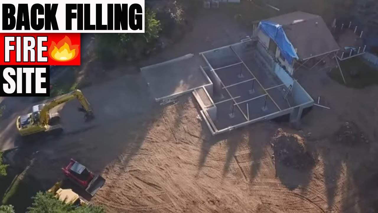 Back filling a house foundation with existing gravel & trucked in stone ...