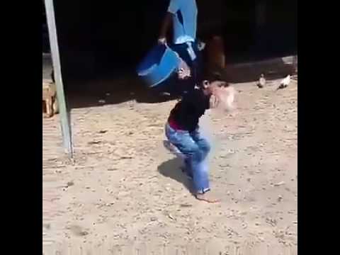 Little kid hitting a chicken - YouTube