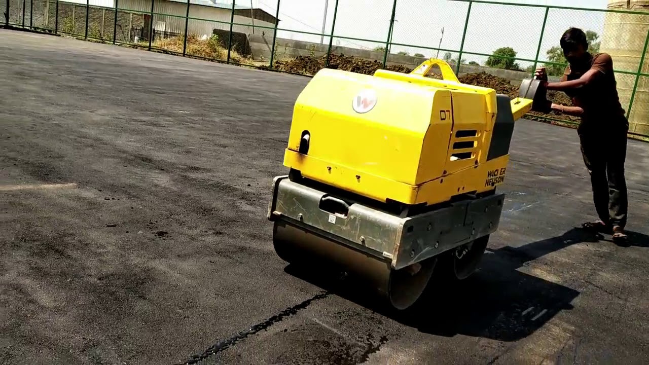 Bitumen compaction by mini roller - YouTube