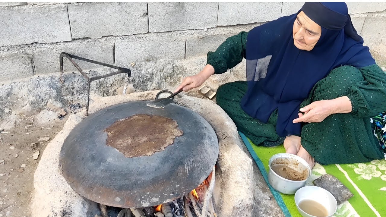 Baking oak bread (Acorn) by a rural women in a traditional way/پخت سنتی نان بلوط توسط زن روستایی ...