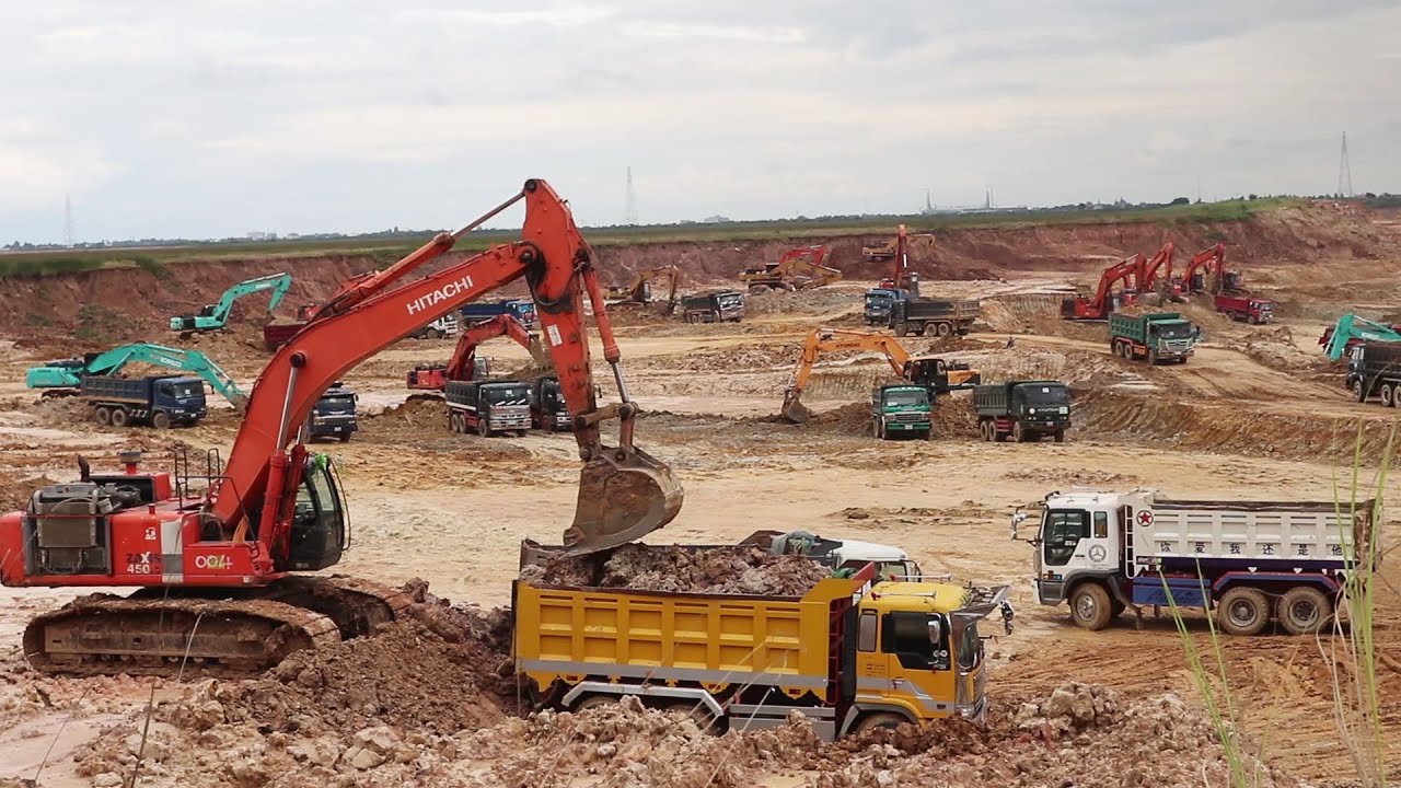 Hitachi Loading Trucks Works Loading Dirt And Interesting Operator ...
