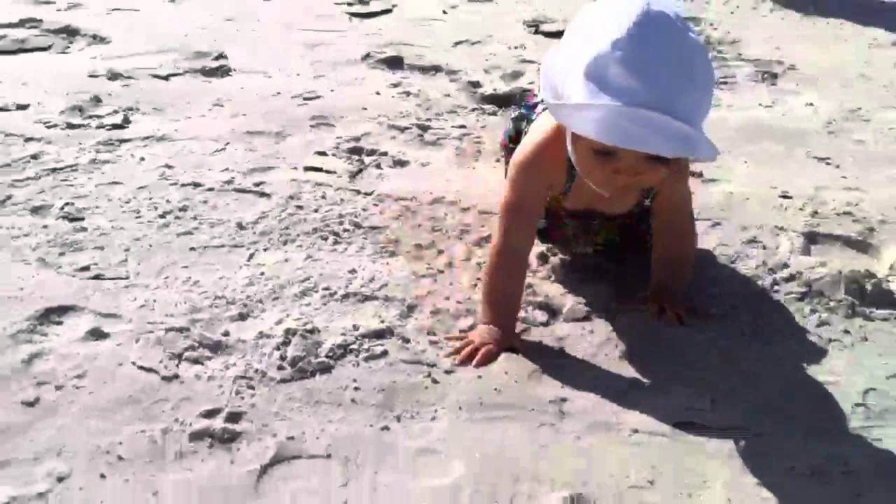 Amelia crawling in the sand - YouTube