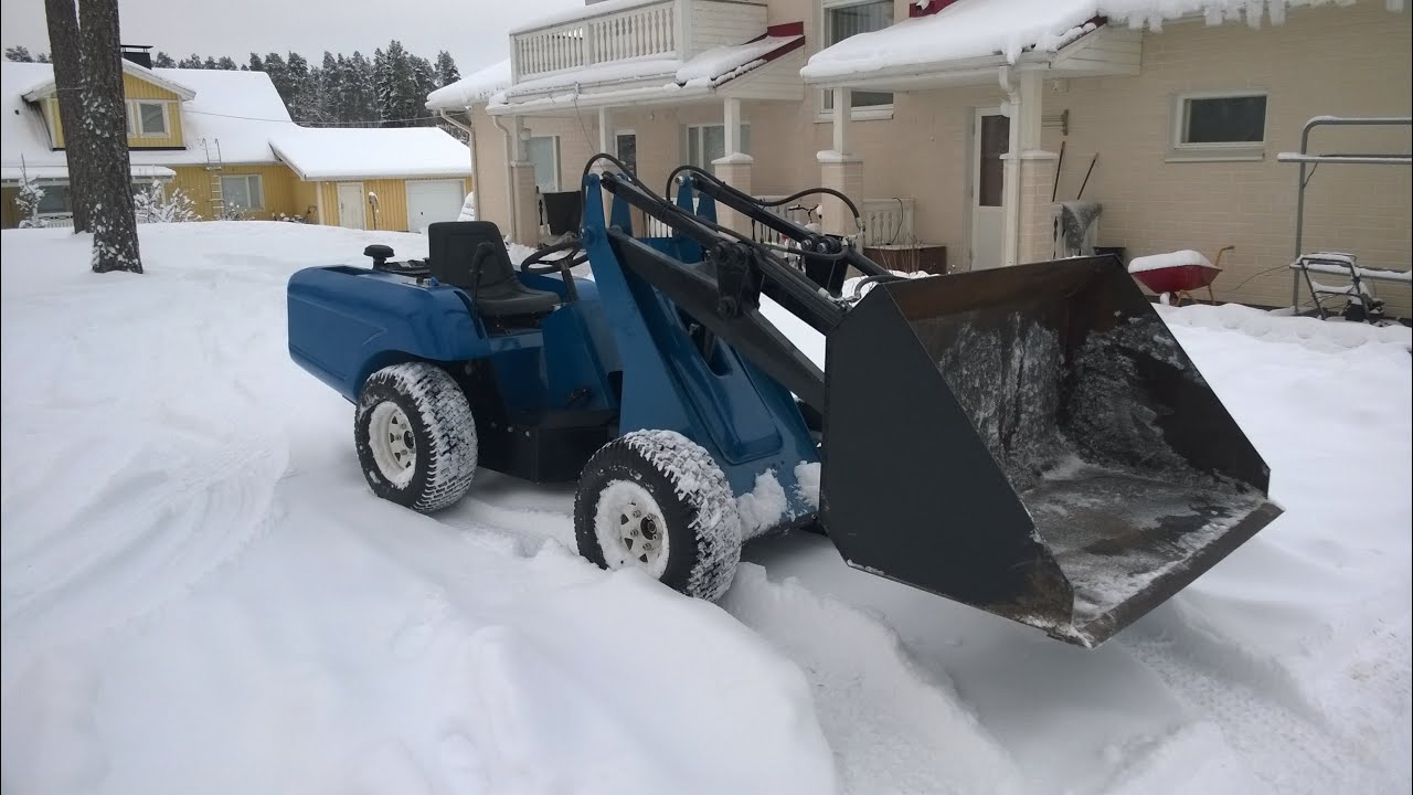 Home made wheel loader eating throught snow - YouTube