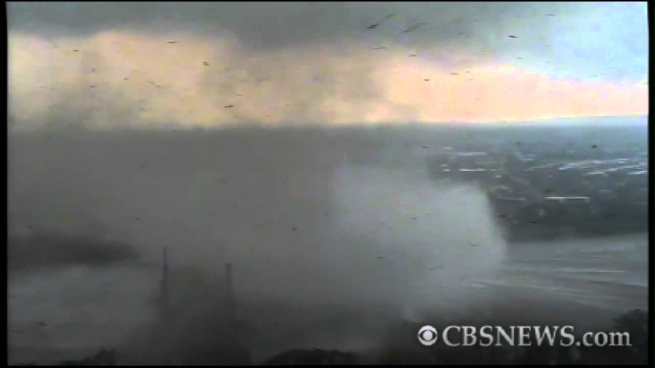 Funnel cloud forms over river - YouTube