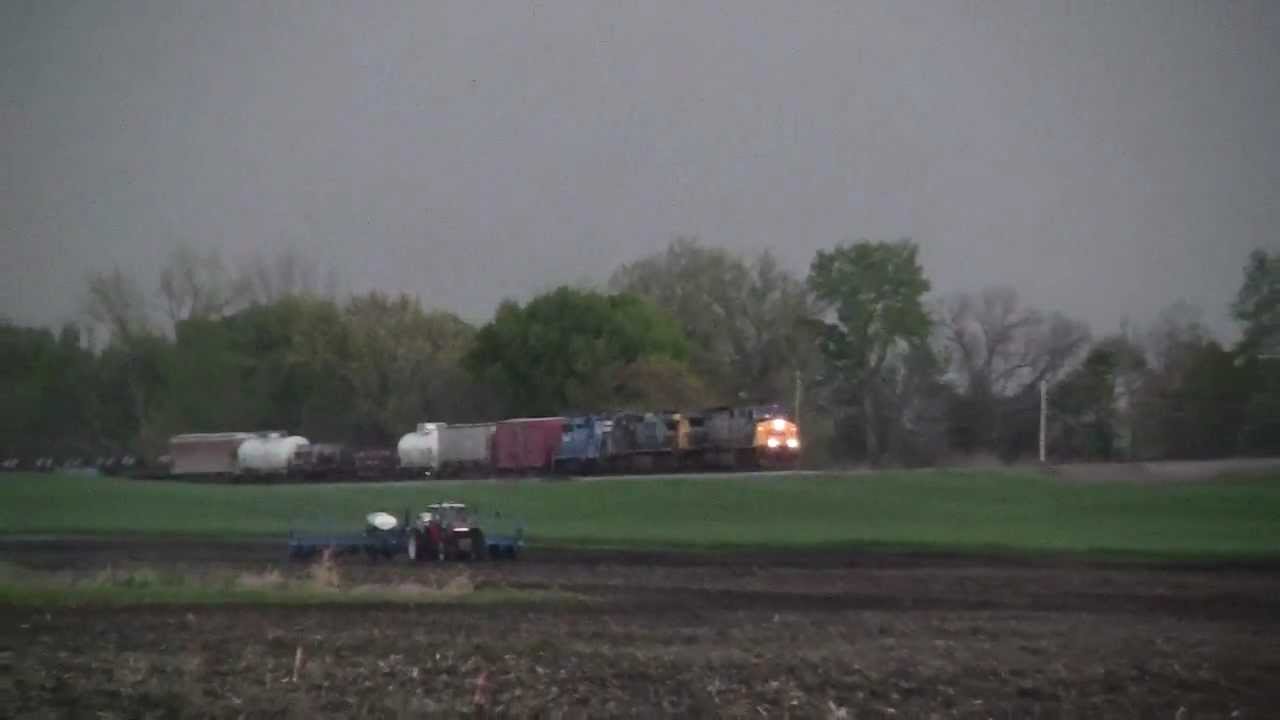 CSX train Q595 passes the corn planter as the thunderstorm rolls on - YouTube