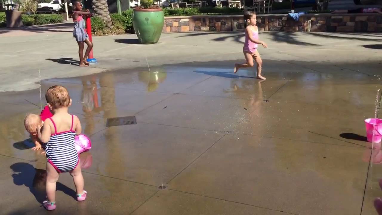 Girls playing at splash pad 2 - YouTube
