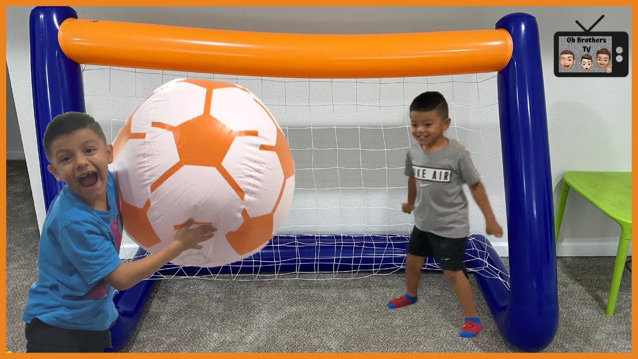 GIANT INFLATABLE SOCCER FUN ! Kids playing soccer - YouTube