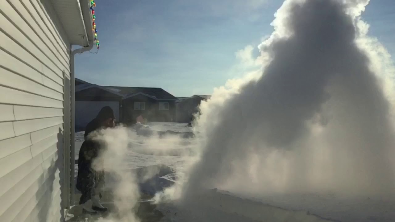 Boiling water freezing in mid air Awesome - YouTube