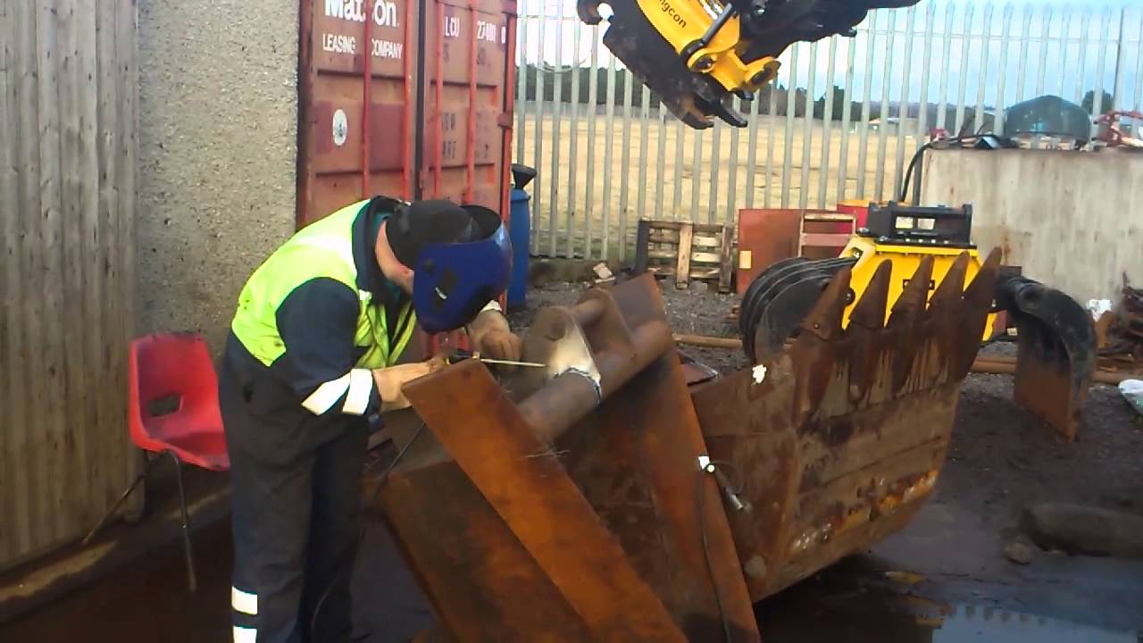 Welding buckets - YouTube