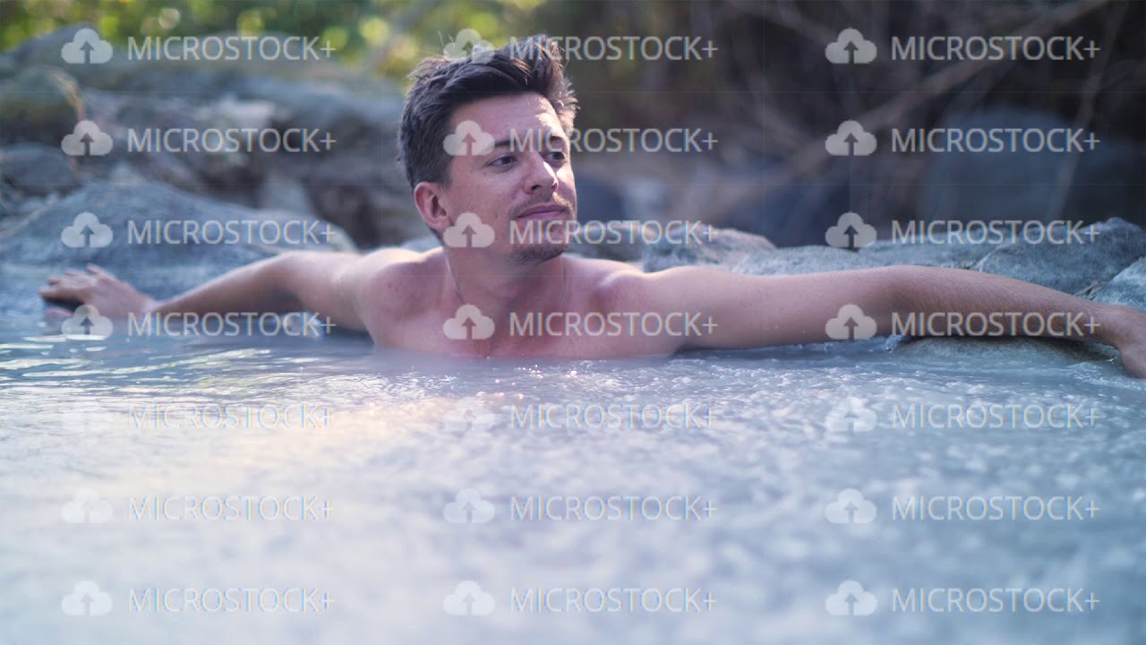 Young man bathing in a hotspring during cold weather. - YouTube