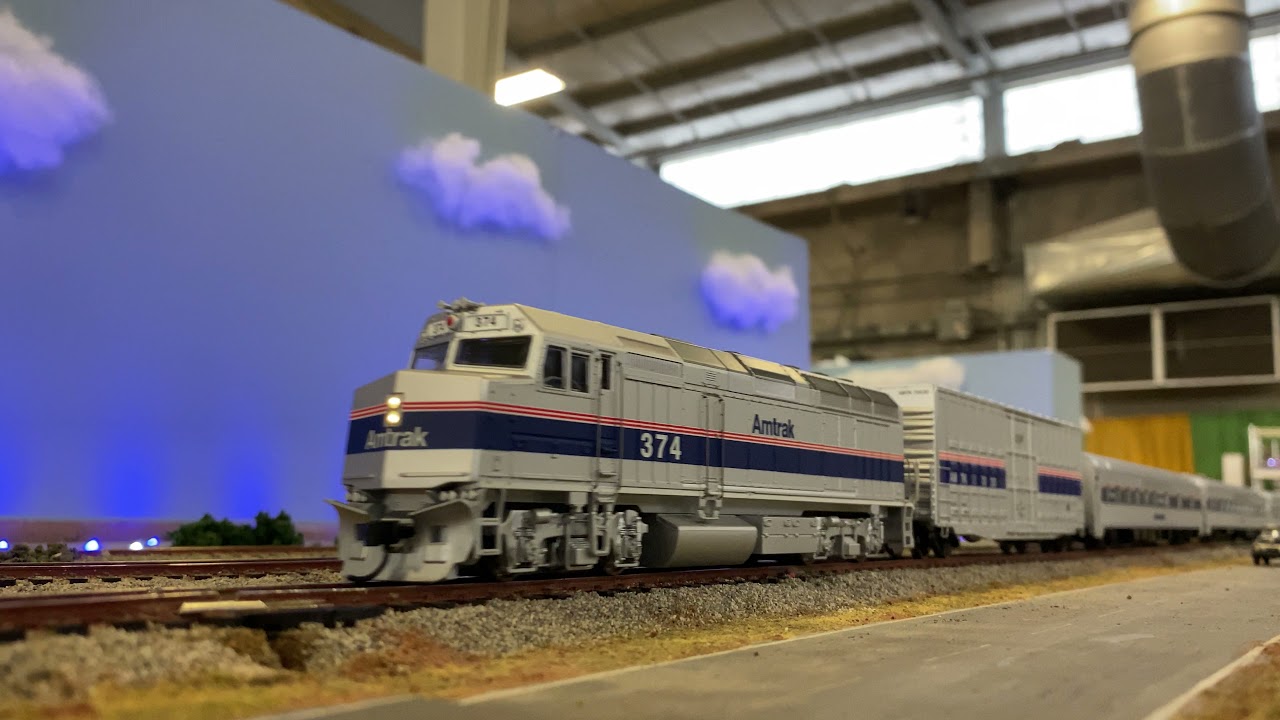 Amtrak 374 F40PH passing by the airport - YouTube