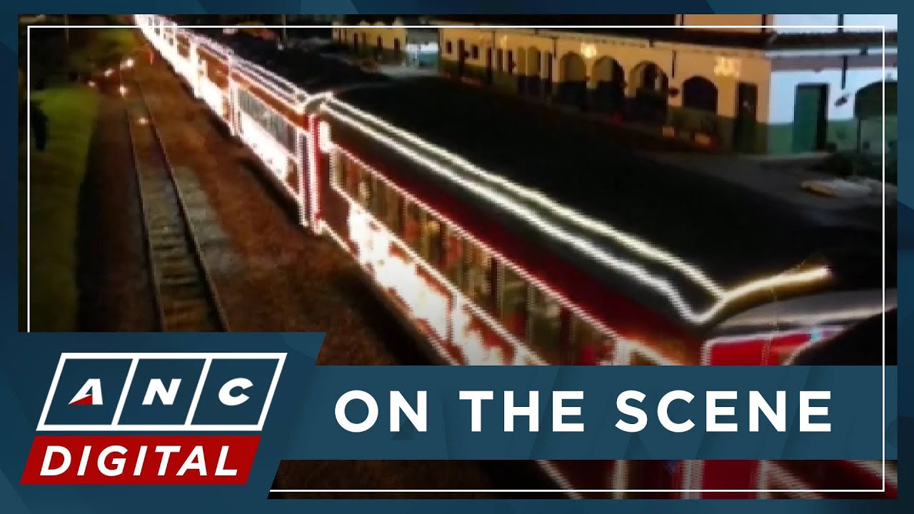 All aboard the Christmas express! Train of lights spread cheer in ...