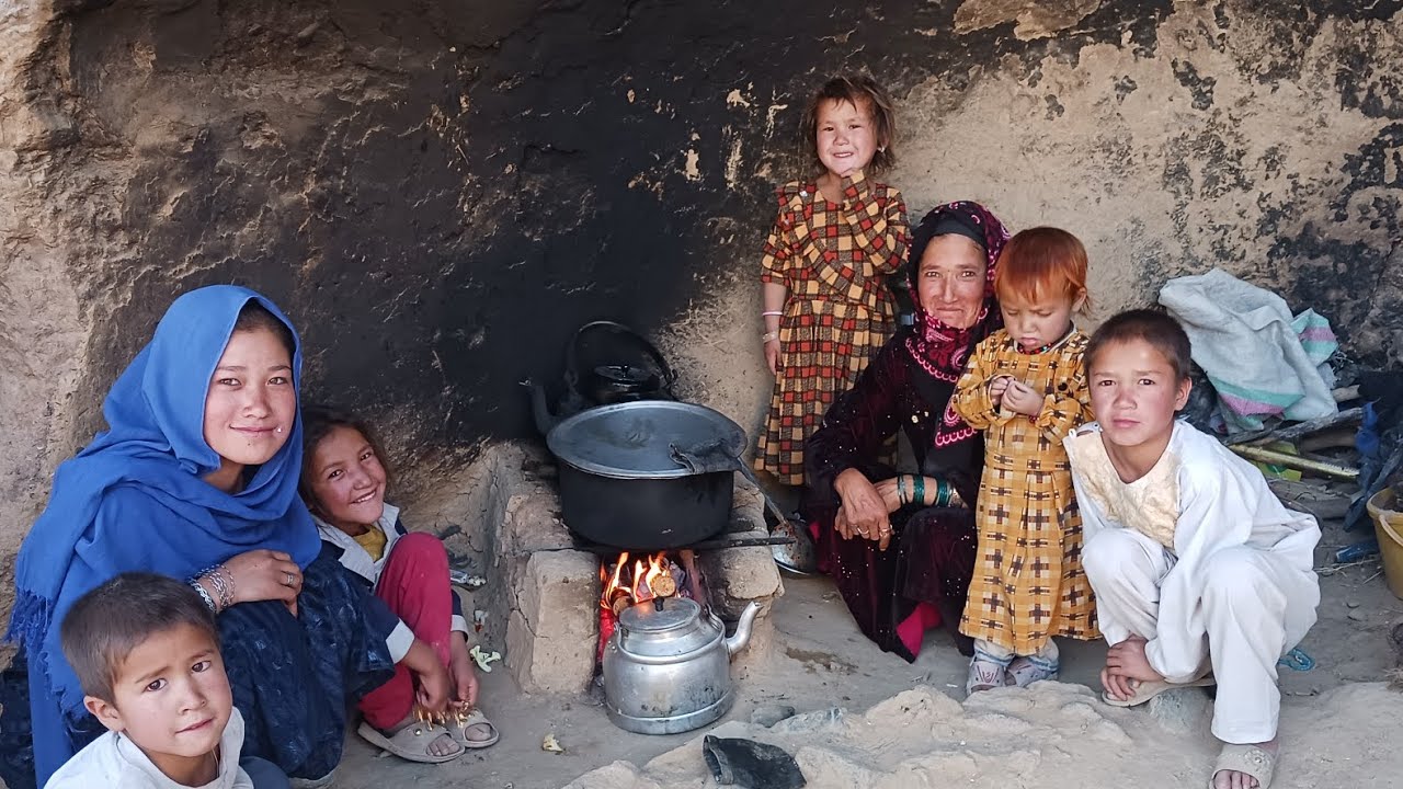 A romantic and beautiful family cooks golpi in the Bamiyan cave in ...