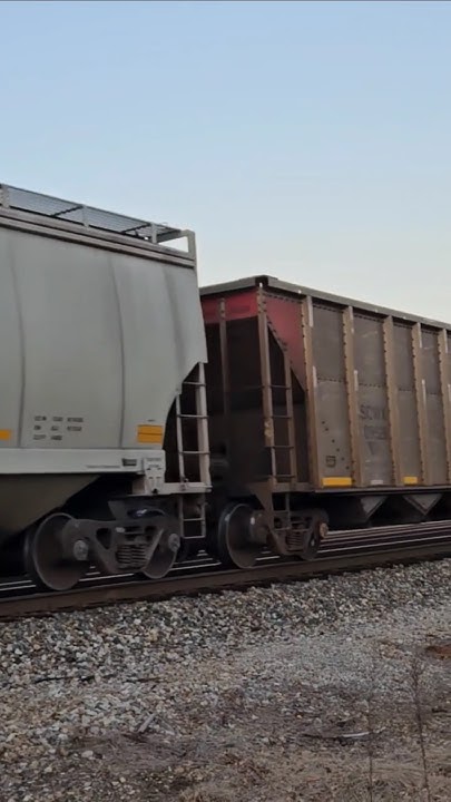 CSX E319 with freight cars followed by empty coal hoppers on the Abbeville Subdivision. - YouTube