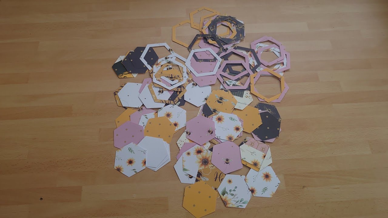 Cutting bee themed paper into hexagons. - YouTube