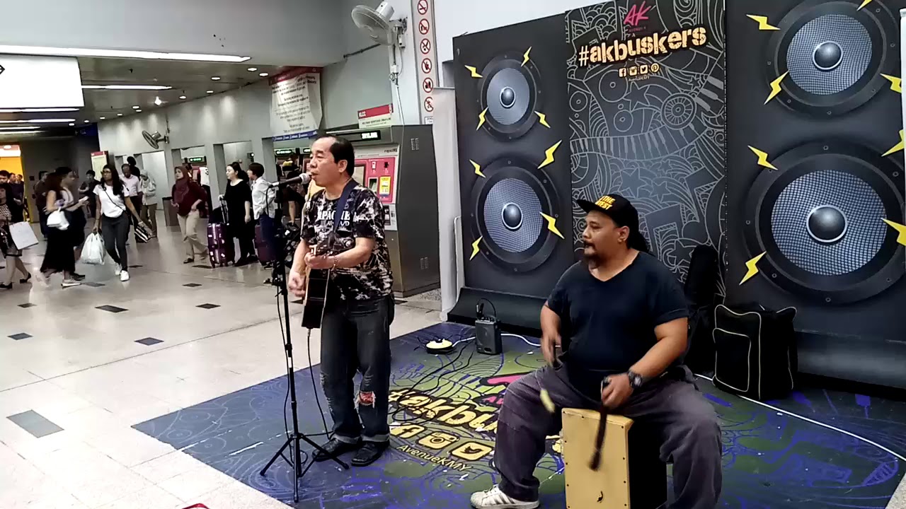 Johnny moi busk session at avenue k - YouTube