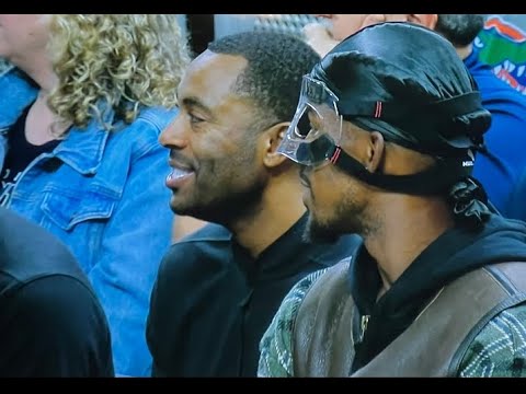 Jimmy Butler wearing a mask on the bench for Nikola Jovic to support ...