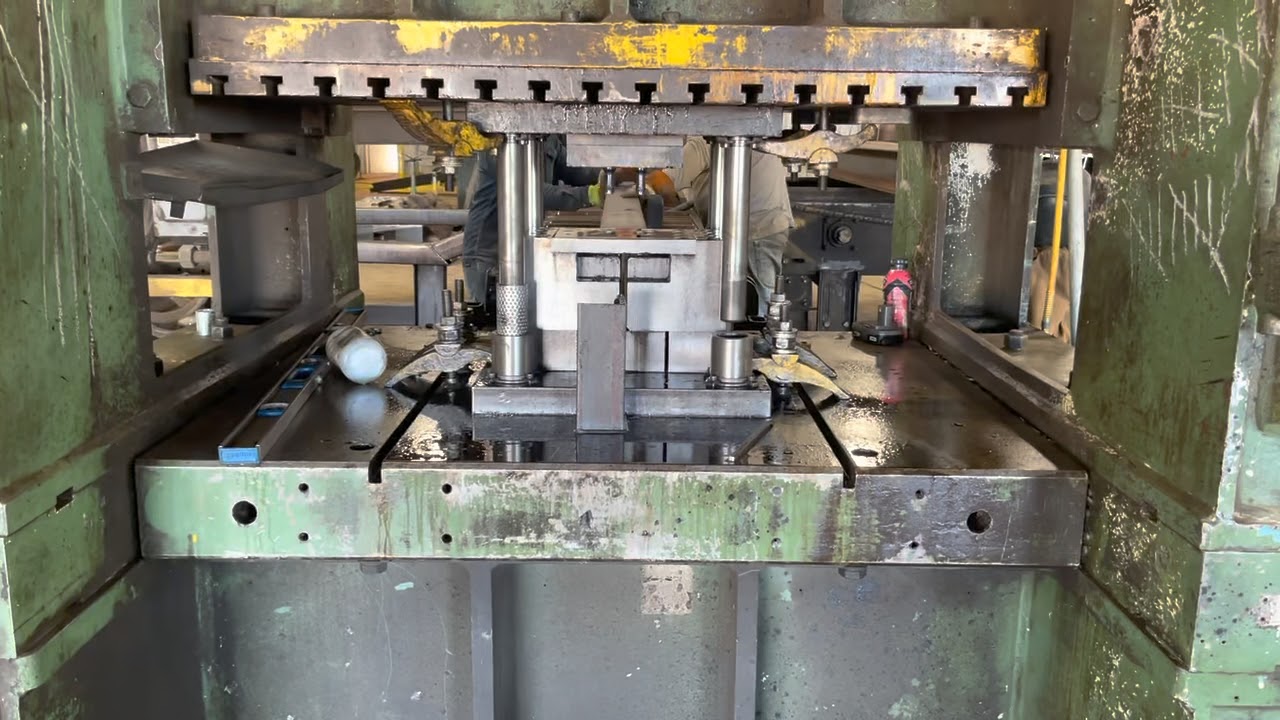 Punch press works on structural beams.. - YouTube