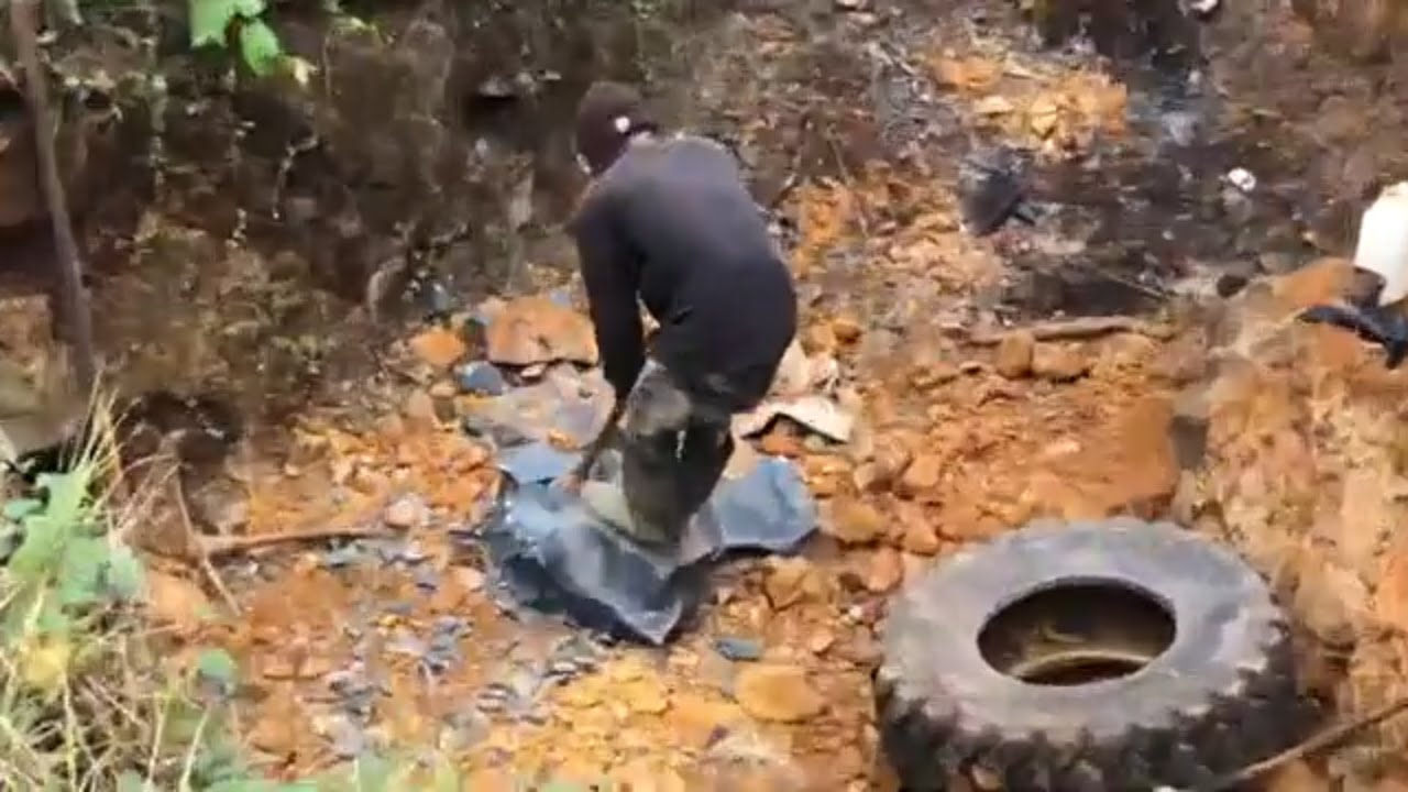 Manual Labour - Breaking and Chiseling Large Rocks in Liberia Manually ...