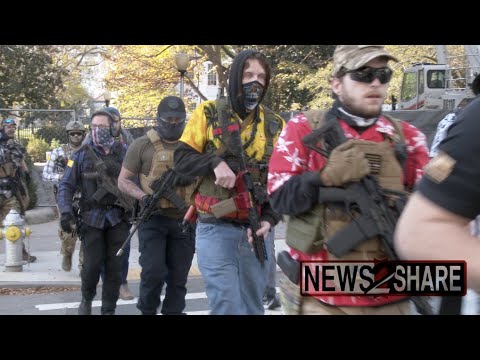 Militia activists march armed through Richmond, VA, where guns at ...
