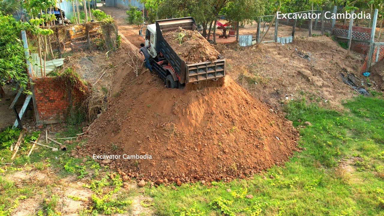 Amazing Activity Dump Truck Unloading Dirt At Deep Slop And Bulldozer ...