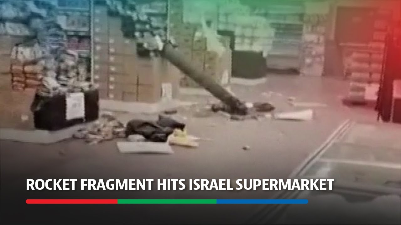 Rocket fragment hits Israel supermarket - YouTube