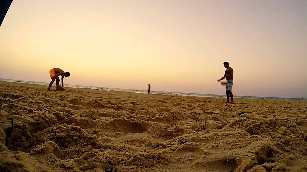 Playing Matkot at the beach - YouTube