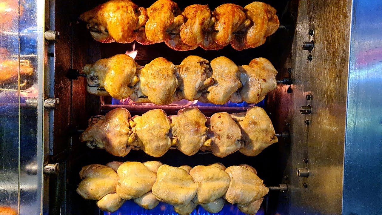 STREET FOOD, HUGE ROTISSERIE CHICKEN, ROAST CHICKEN ROASTED ON THE ...