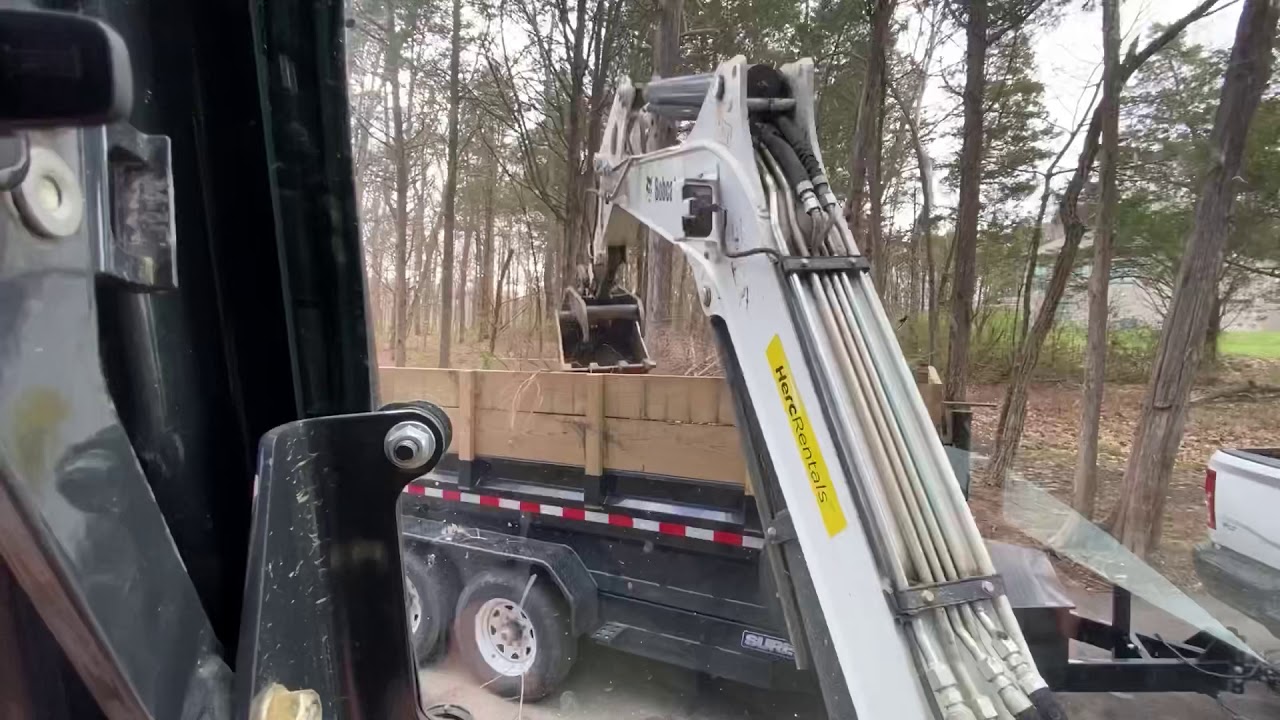 Loading dump trailer with mini excavator - YouTube