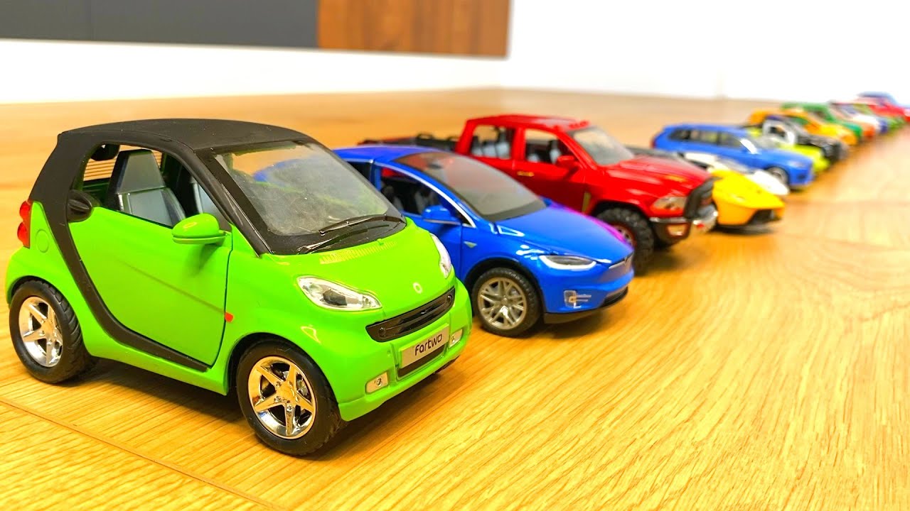 Smaller and Bigger Welly Diecast Model Cars Stopped By Finger. Cars go ...