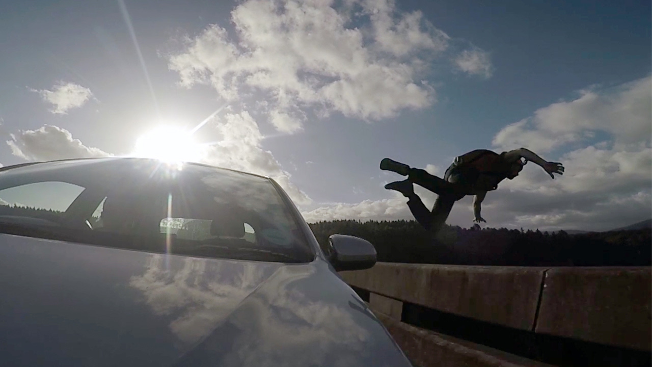 Daredevil Base Jumps From Moving Car - YouTube