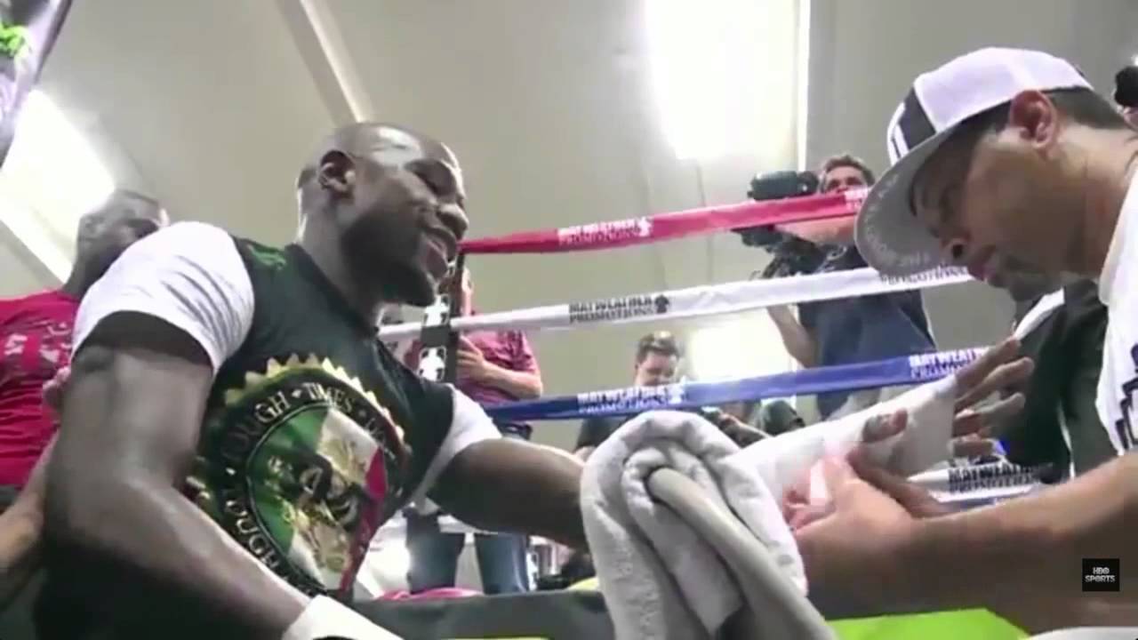 Mayweather getting his hands wrapped by Rafael Garcia - YouTube