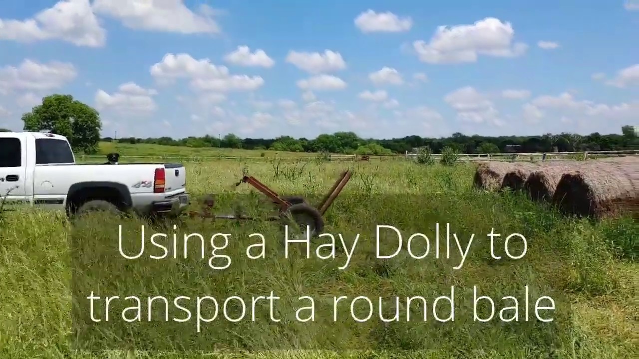 Using a Hay Dolly to pick up, transport and place a 1000 pound round ...