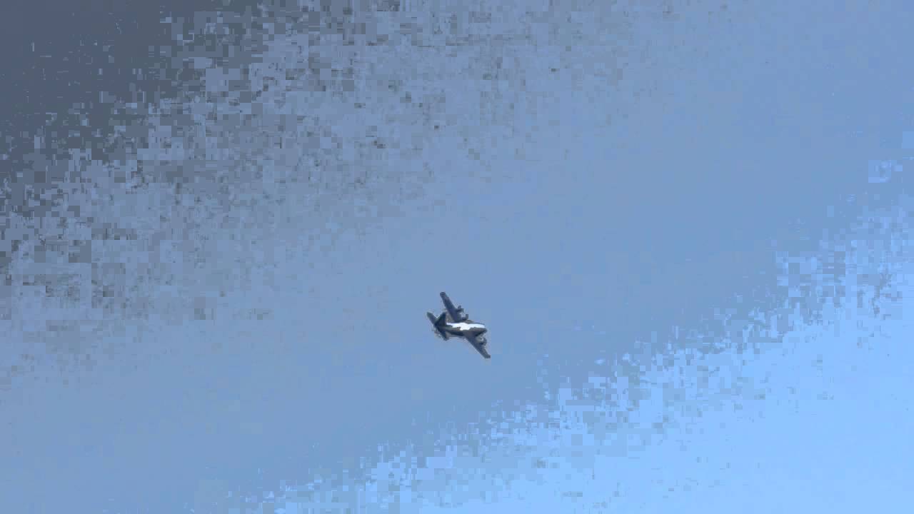 Big Blue Angel flying over the beach - YouTube