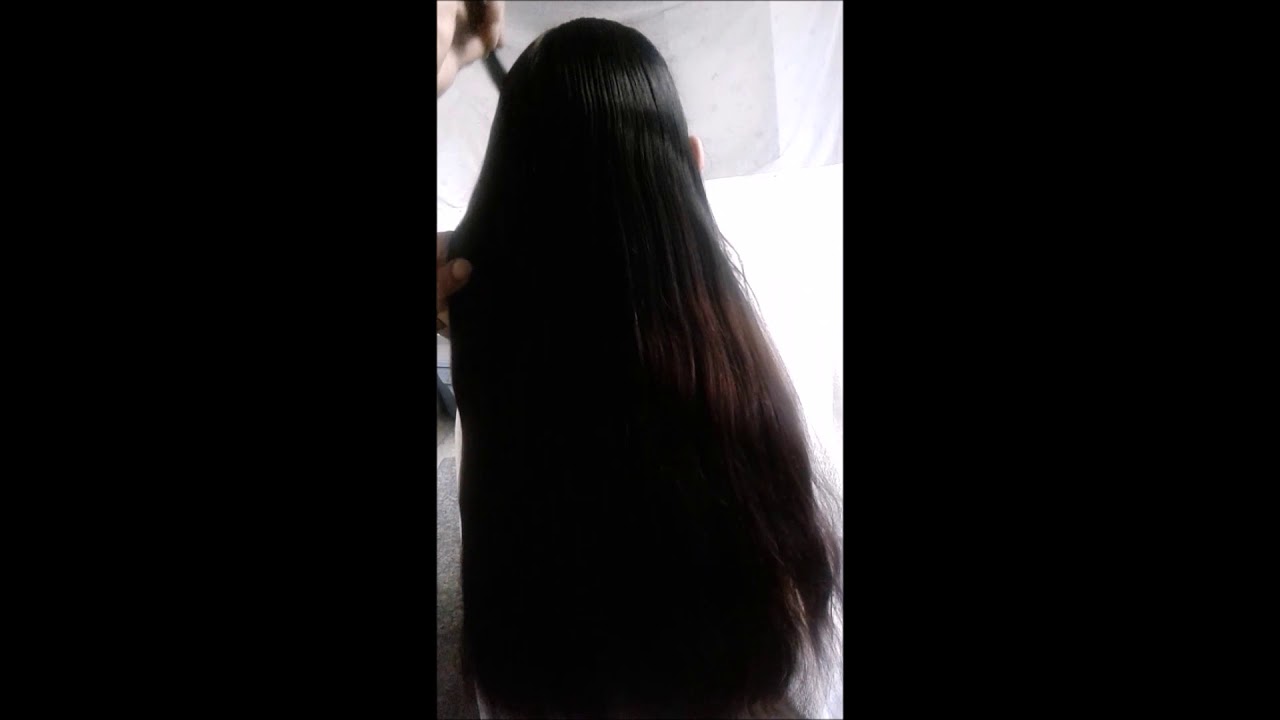 Sectioning and combing long hair forward by man - YouTube