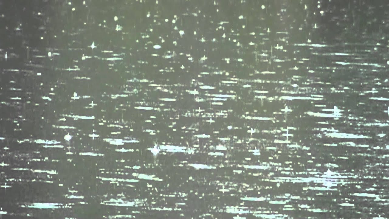 slow motion raindrops on a lake - YouTube